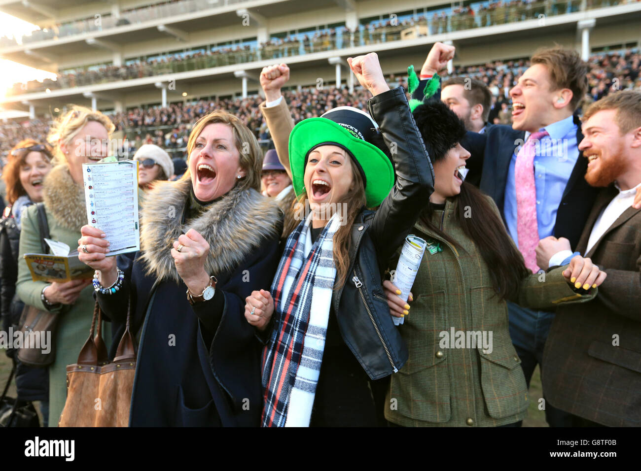 Racegoers cheer on the horses during the Trull House Stud Mares ...