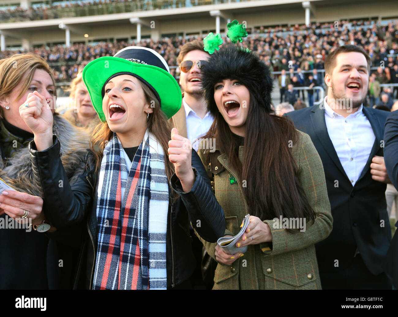 Racegoers cheer on the horses during the Trull House Stud Mares ...