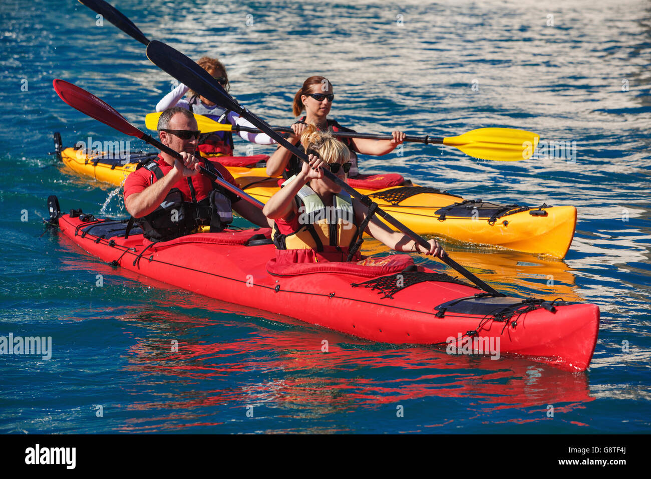 Group of people kayaking on river Stock Photo - Alamy