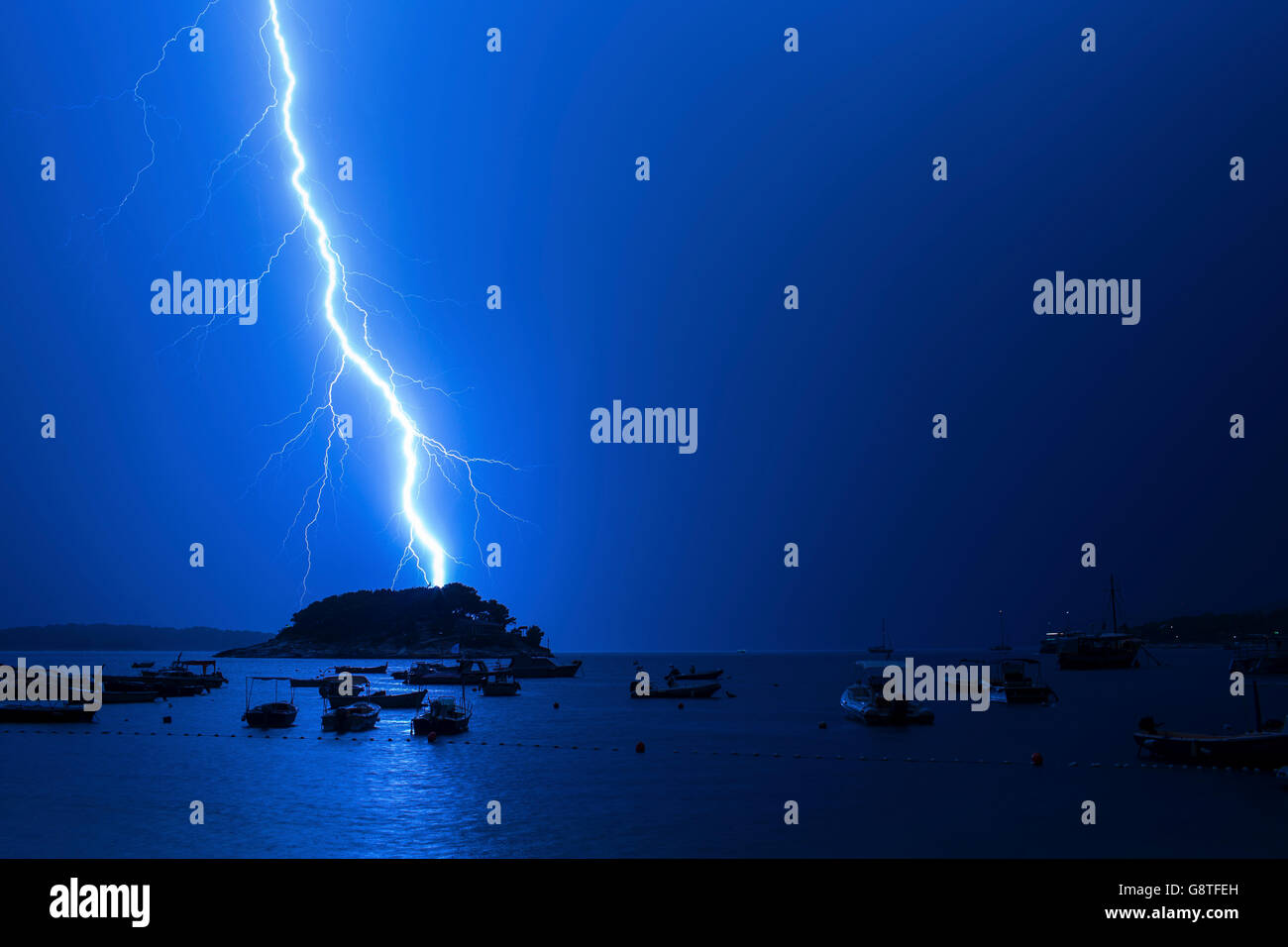 Lightnings in thunderstorm over harbor at night Stock Photo - Alamy