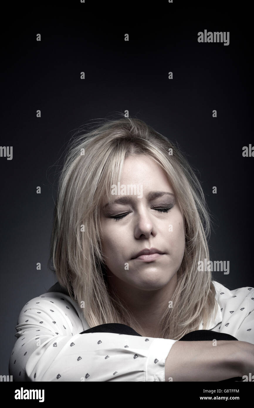 Hugging knees hi-res stock photography and images - Alamy