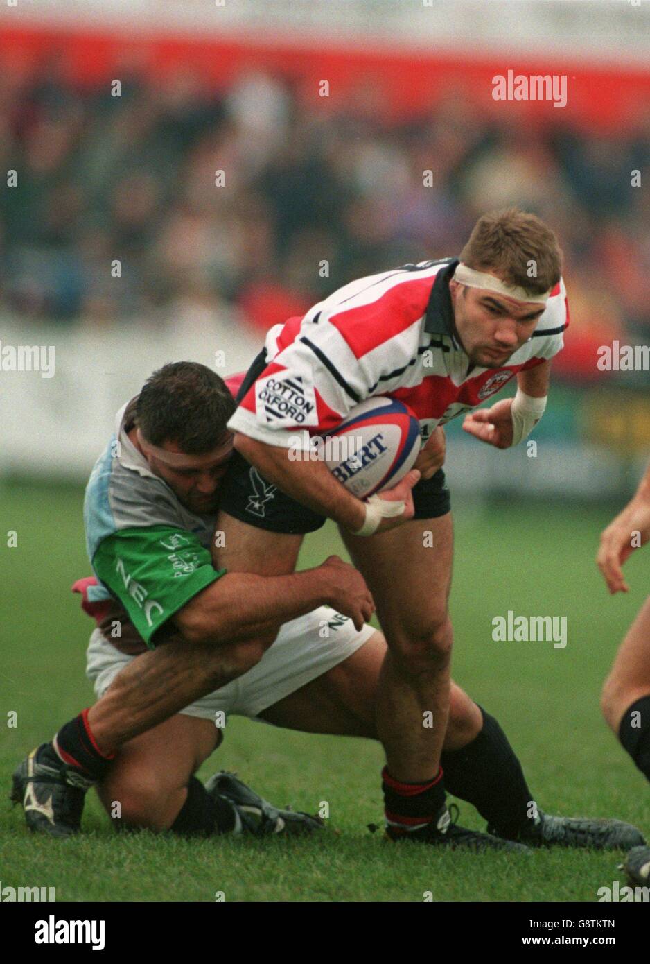 Jason leonard of harlequins left tackles carter of gloucester right hi ...