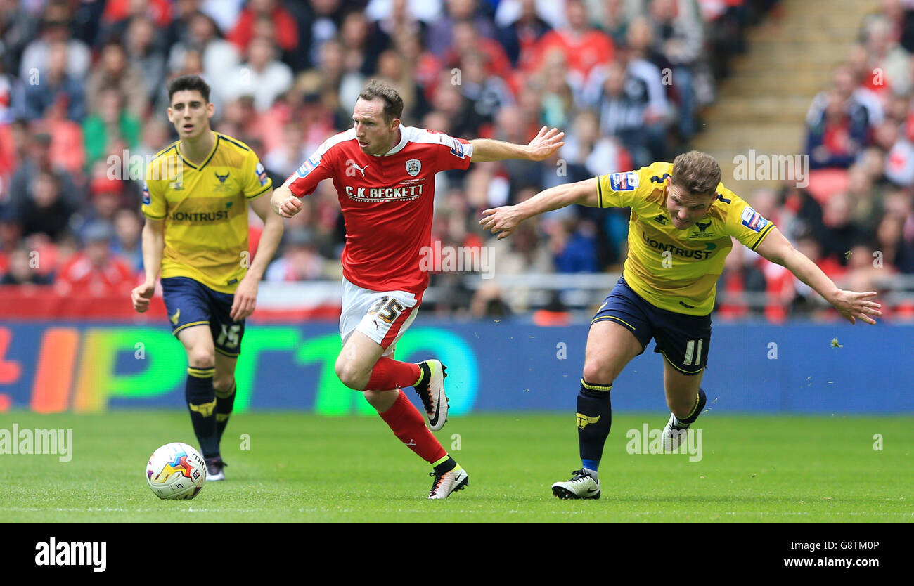 Barnsley's Aidan White (centre) and Oxford United's Alexander MacDonald ...