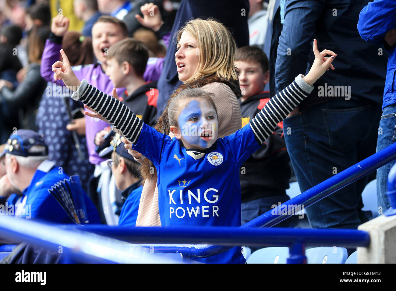 A young Leicester City fan celebrates her side's victory in the stands ...