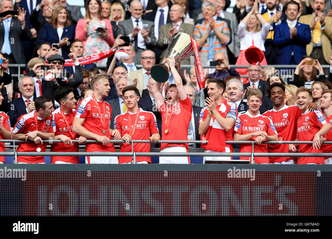 Barnsley's Sam Winnall lifts the Johnstone's Paint Trophy at Wembley ...