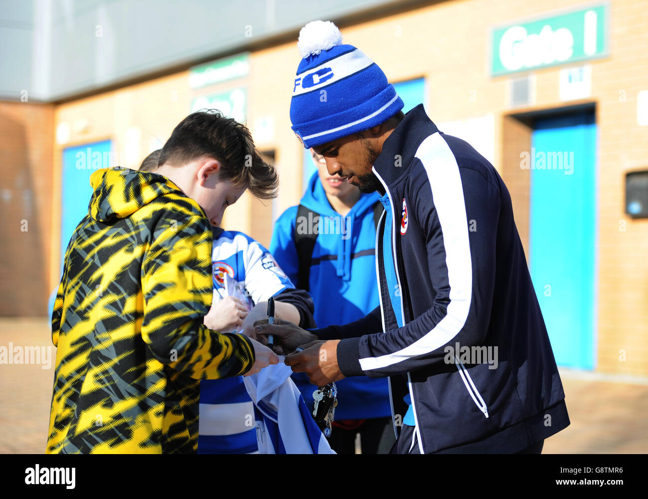Reading's Garath McCleary (right) signs autographs for fans before kick ...