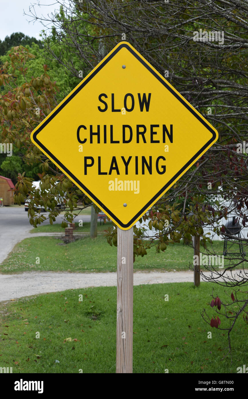A sign warning of children playing in the street Stock Photo - Alamy