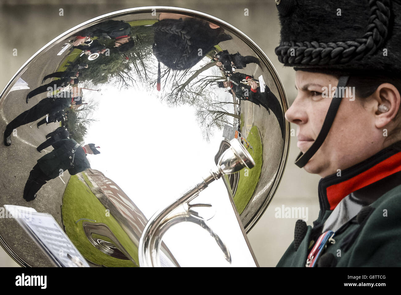 A reflection in a tuba played by The Rifles Band and Bugles during a ...