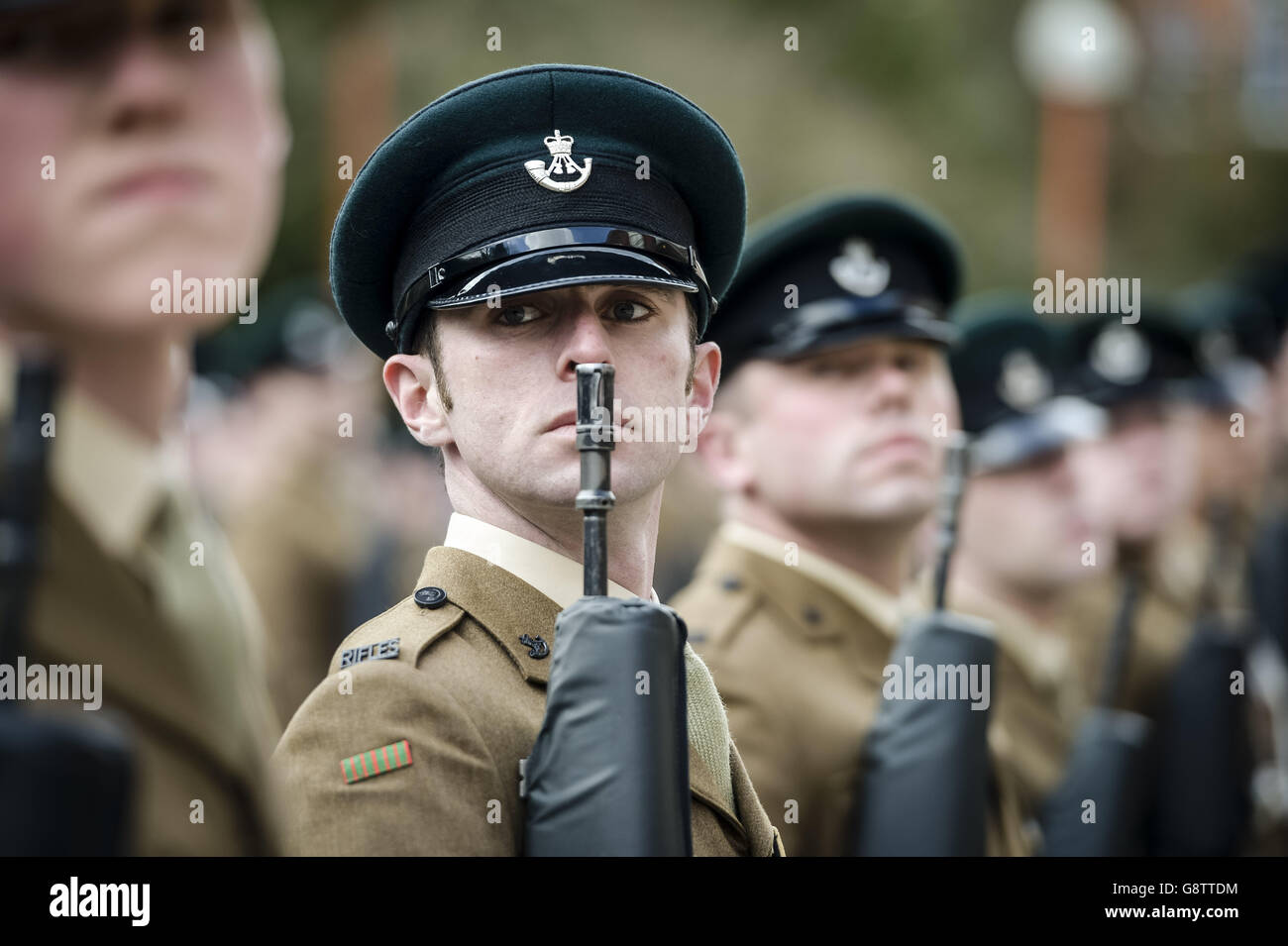 Soldiers from 3rd Battallion The Rifles perform a 'right dress' command ...