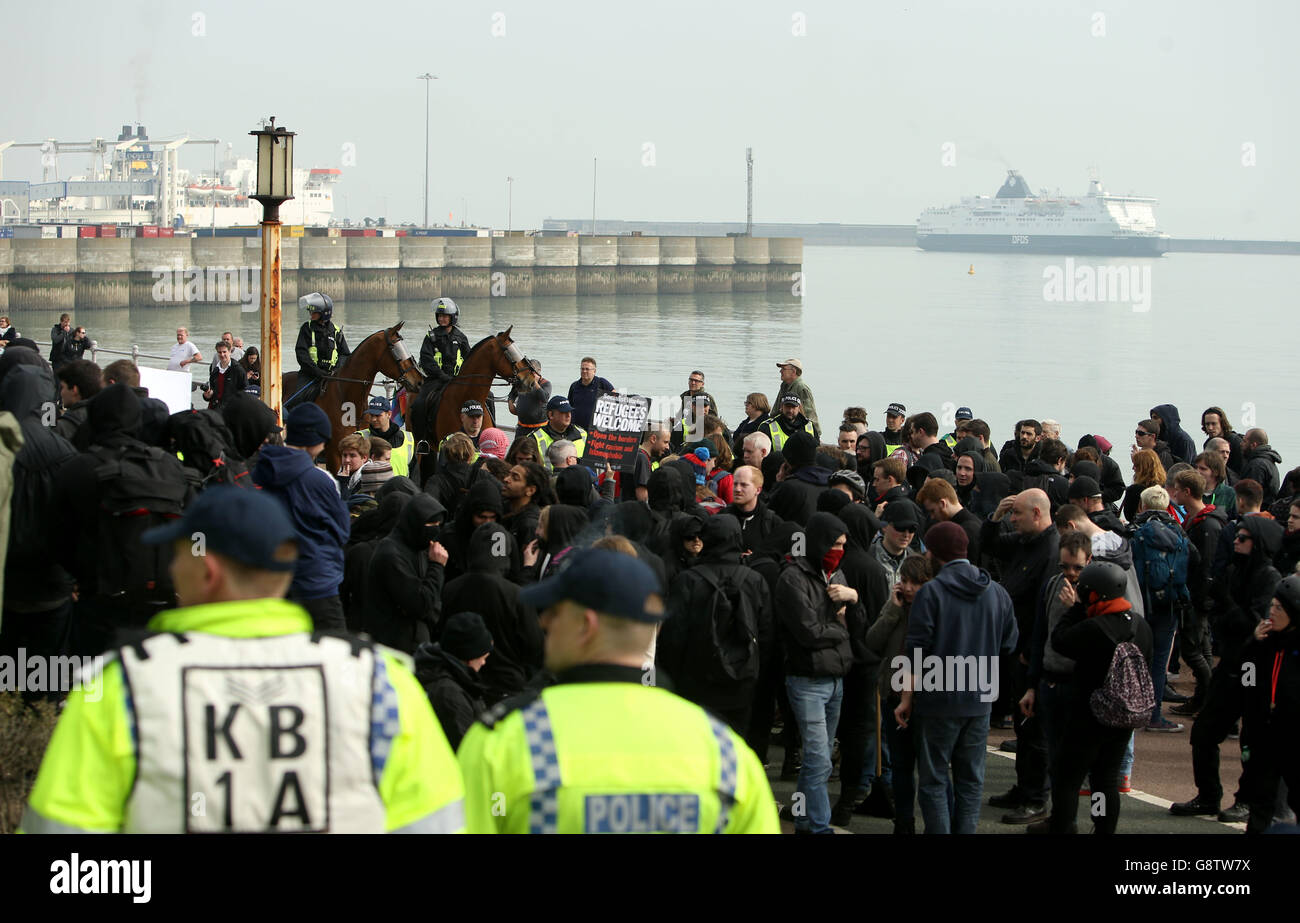 Police officers look on at members of a counter demonstration by the ...
