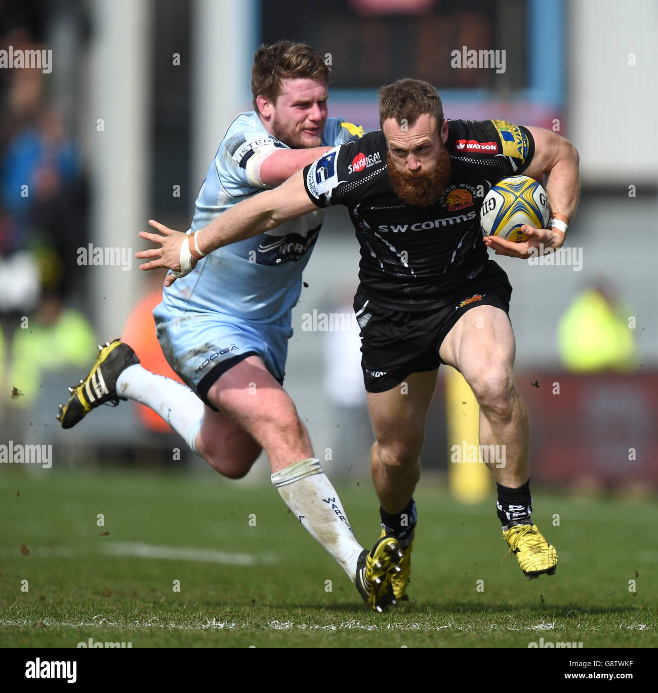 Exeter Chiefs' James Short (right) hands off Worcester Warriors' Niall ...