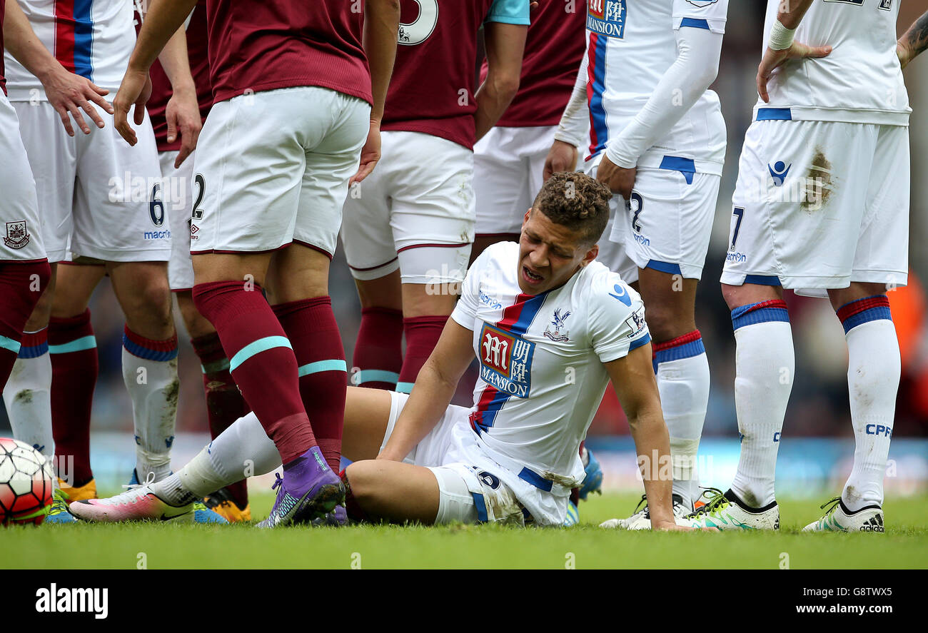 Crystal Palace's Dwight Gayle holds his leg after a challenge during ...