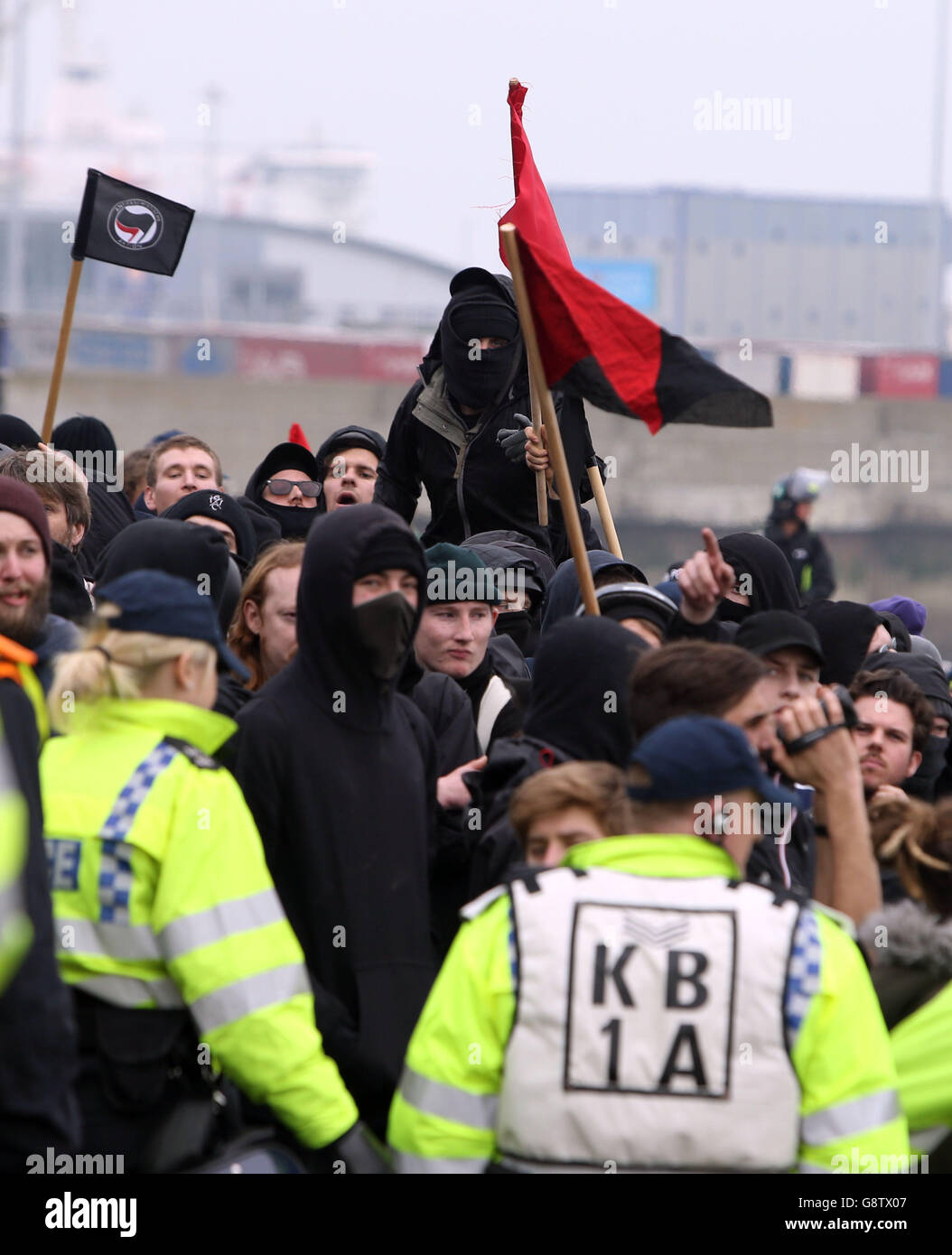 Police officers look on at members of a counter demonstration by the ...