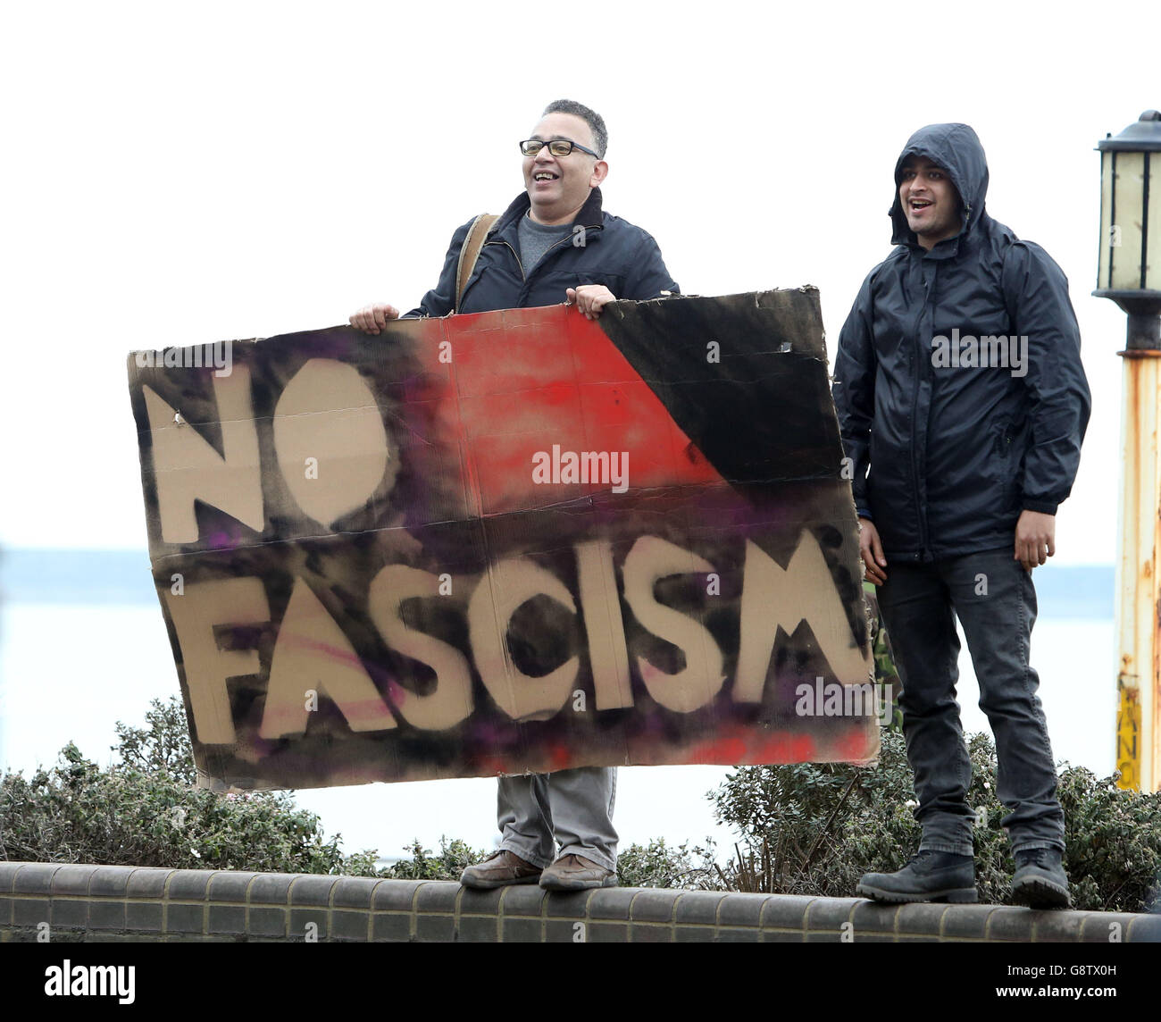 Police officers look on at members of a counter demonstration by the ...