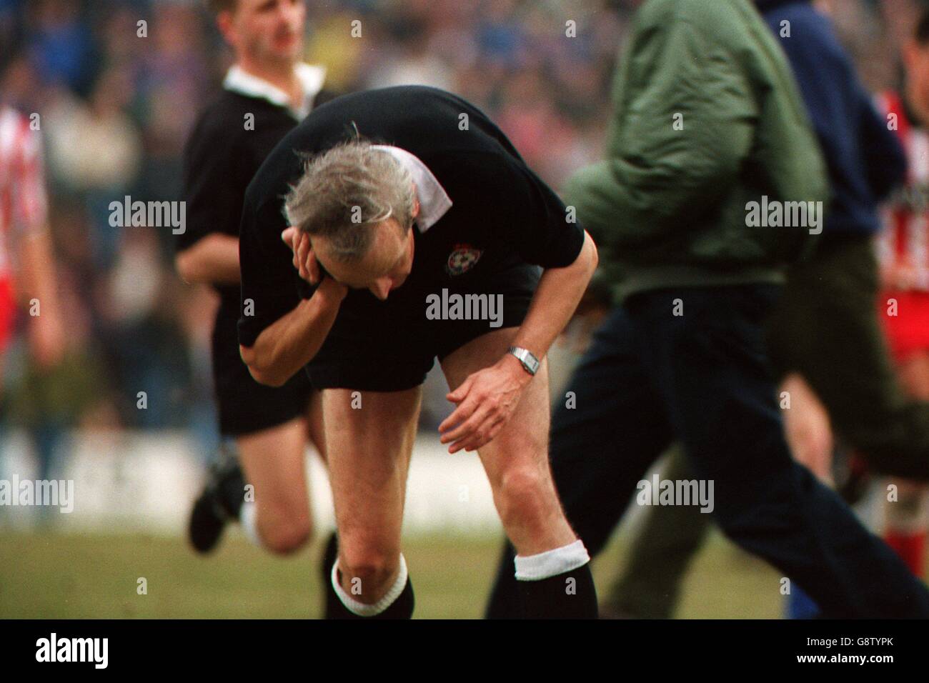 Referee roger wiseman is hit on the head by fan hi-res stock ...