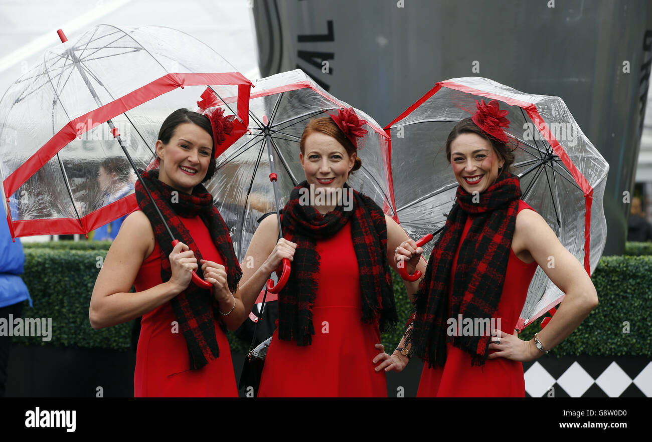 Female racegoers arrive during the Grand Opening Day of the Crabbie's ...