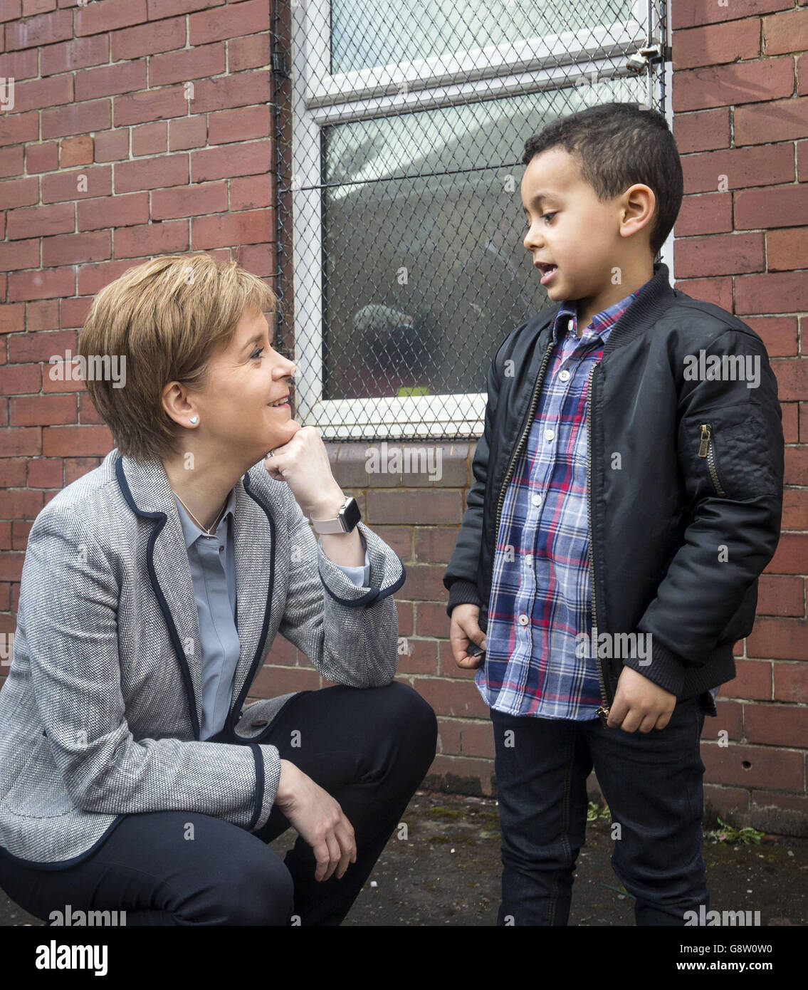 SNP leader Nicola Sturgeon meets a child during a visit to Home-Start ...