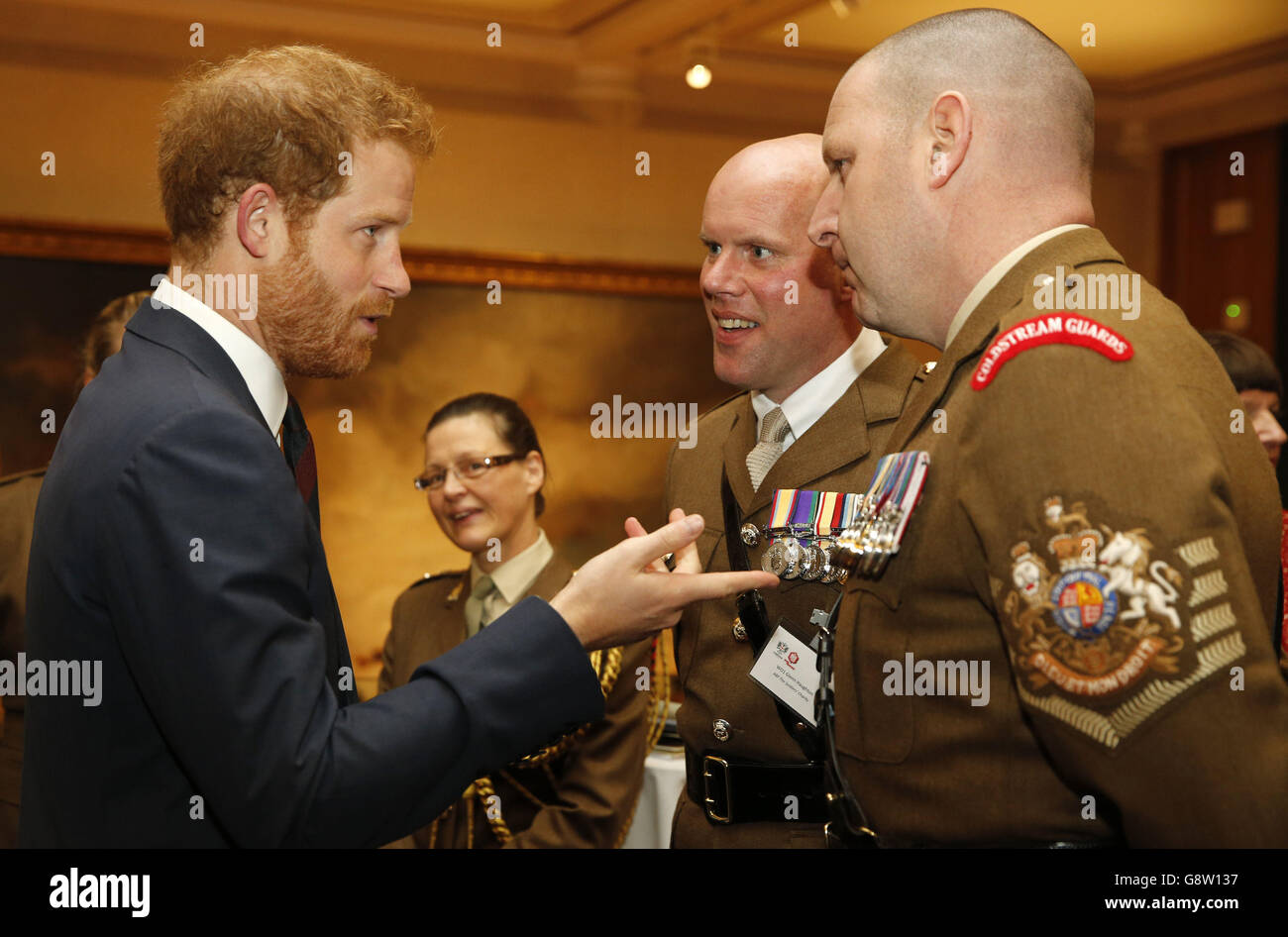 Prince Harry (left) talks to Command Sergeant Major Glenn Haughton ...