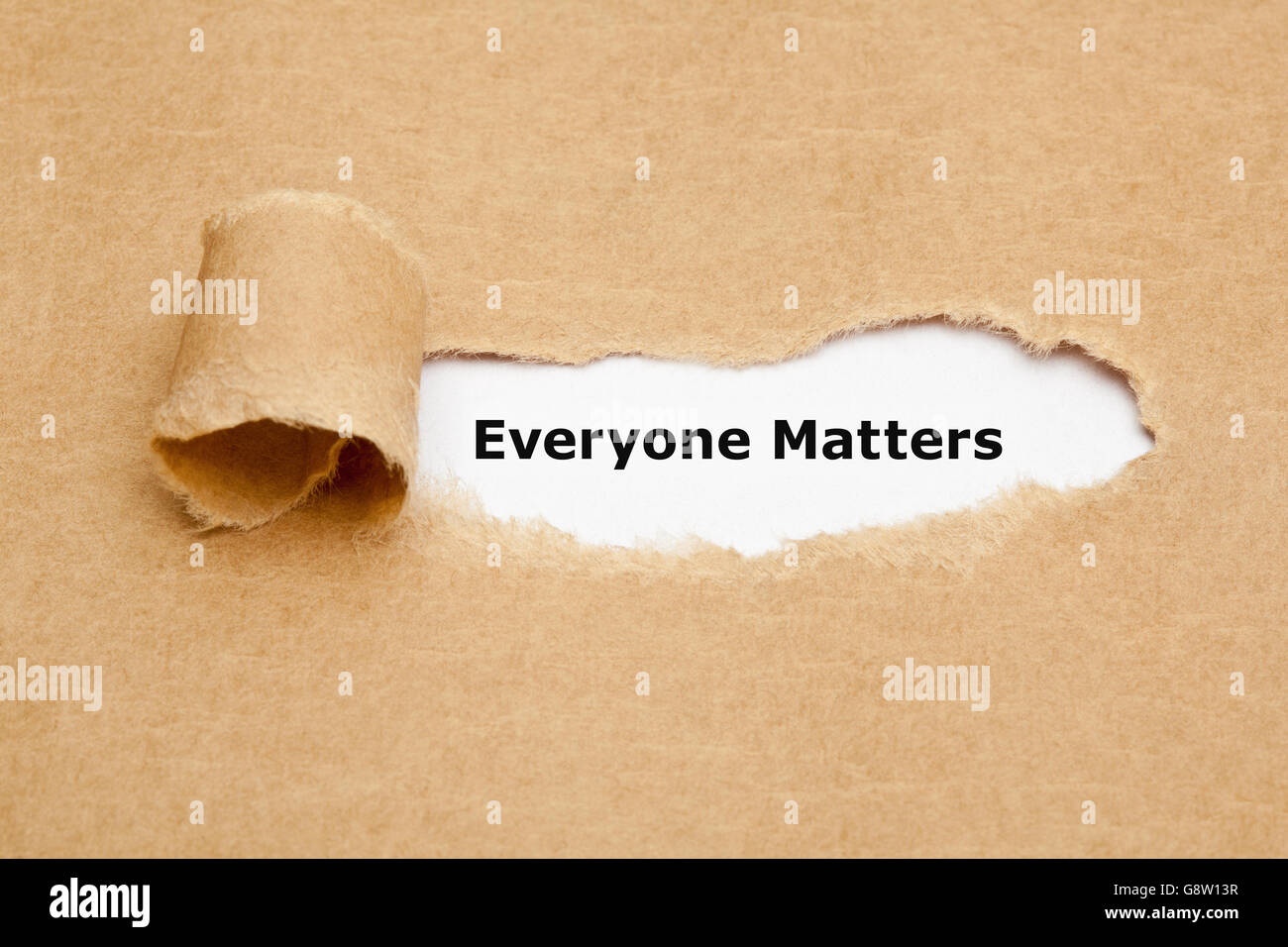 The text Everyone Matters appearing behind ripped brown paper Stock ...