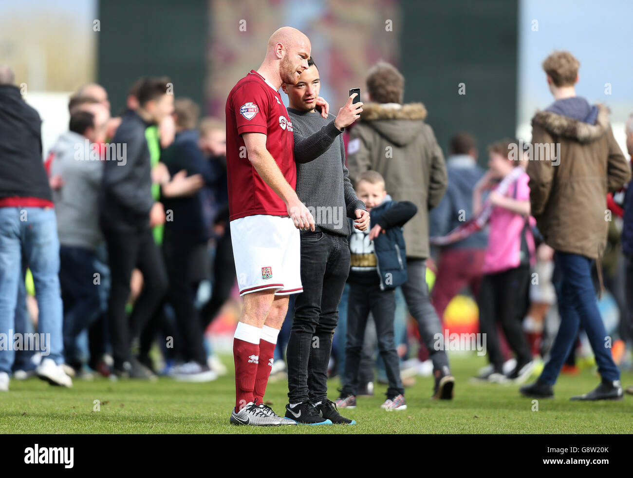 Northampton Town's Jason Taylor celebrates with a fan after winning ...