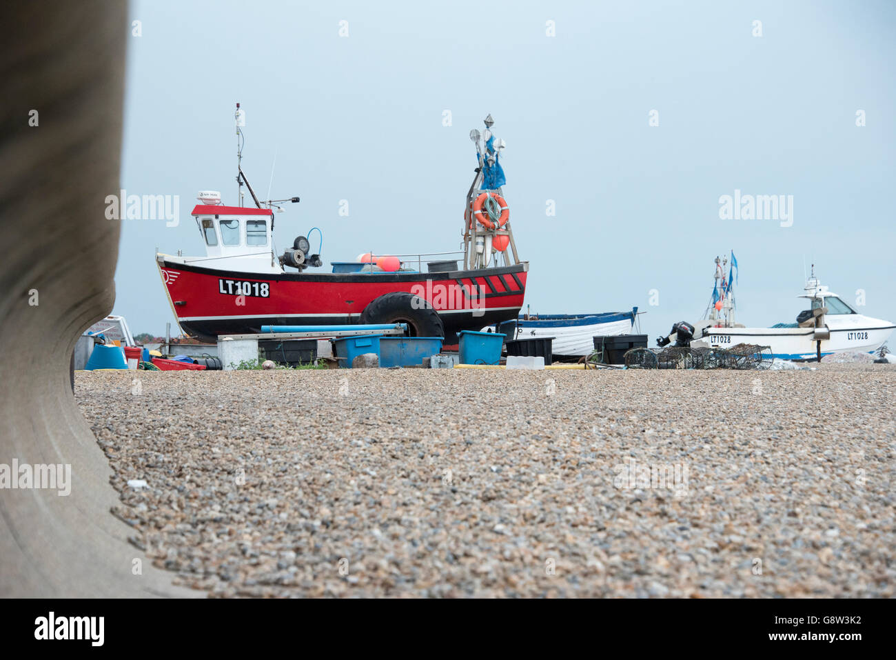 Fishing boat and sea break Stock Photo - Alamy