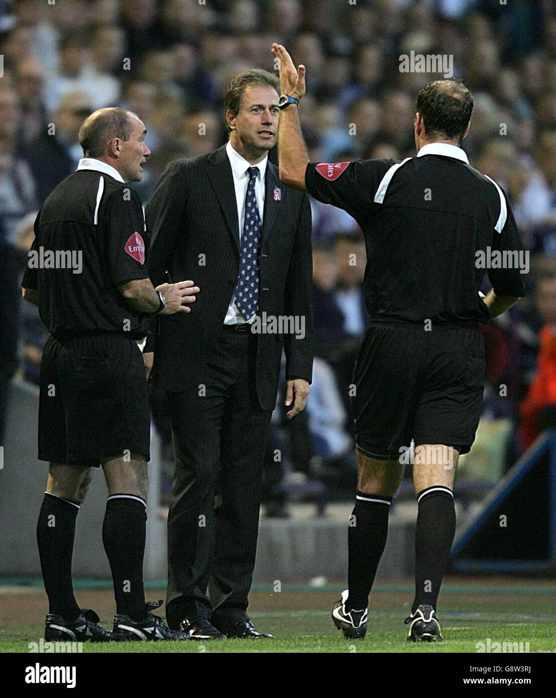 Portsmouth manager Alain Perrin (C) is ordered from pitchside by ...