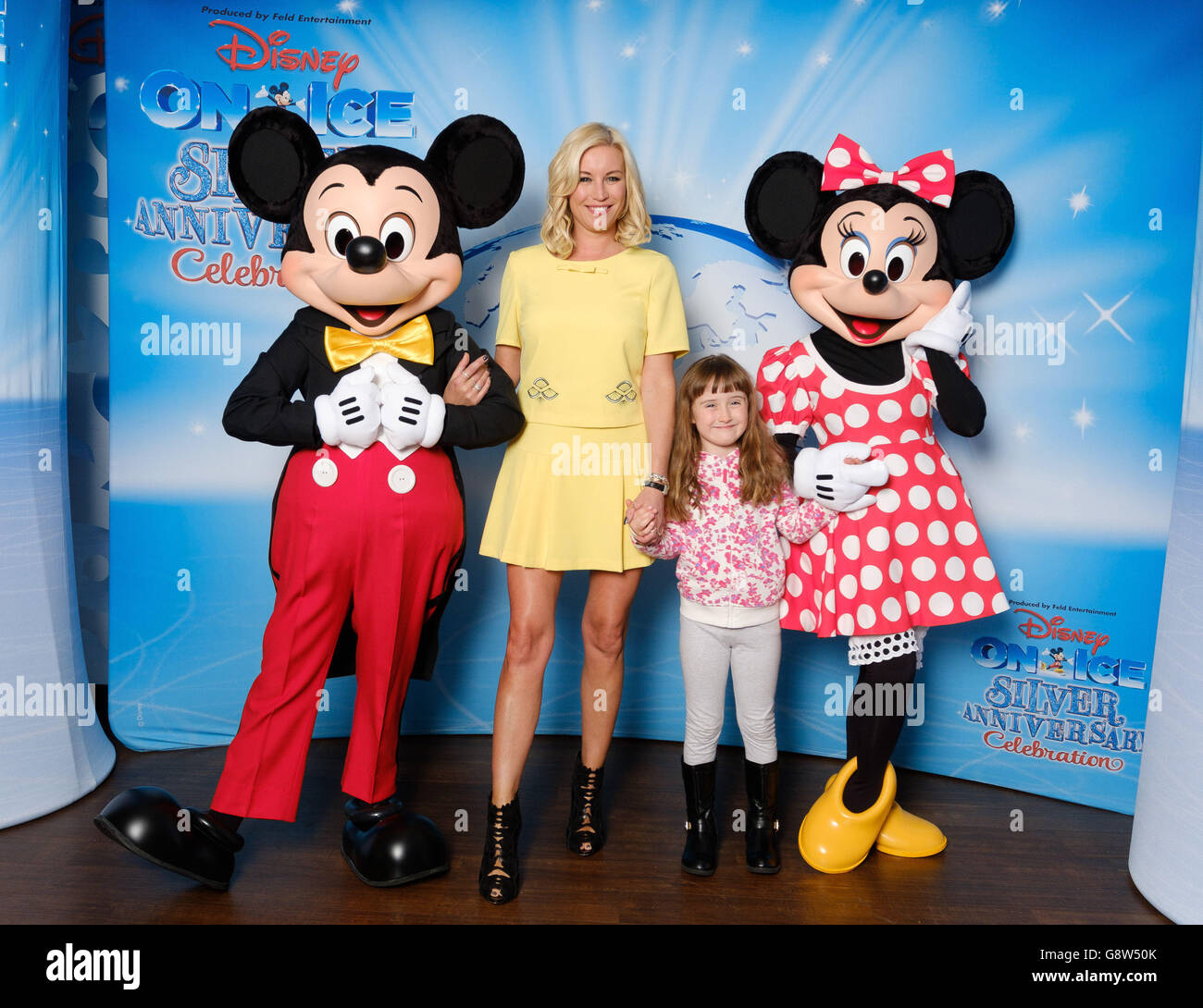 Denise Van Outen and her daughter Betsy, aged 5, are greeted by Mickey ...