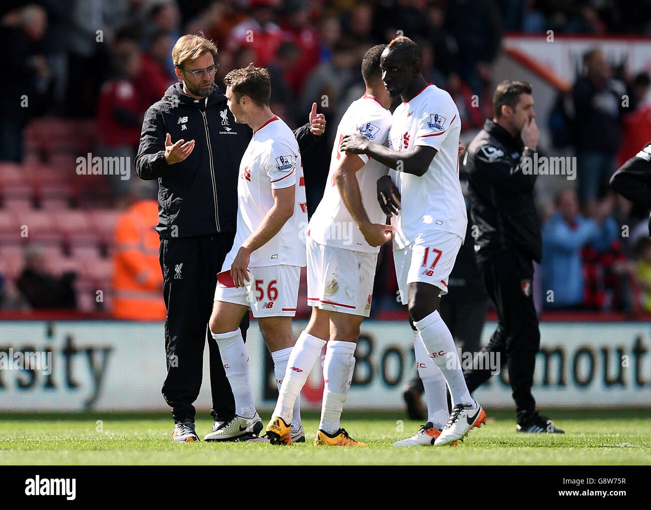 Liverpool manager Jurgen Klopp celebrates their victory with Connor ...