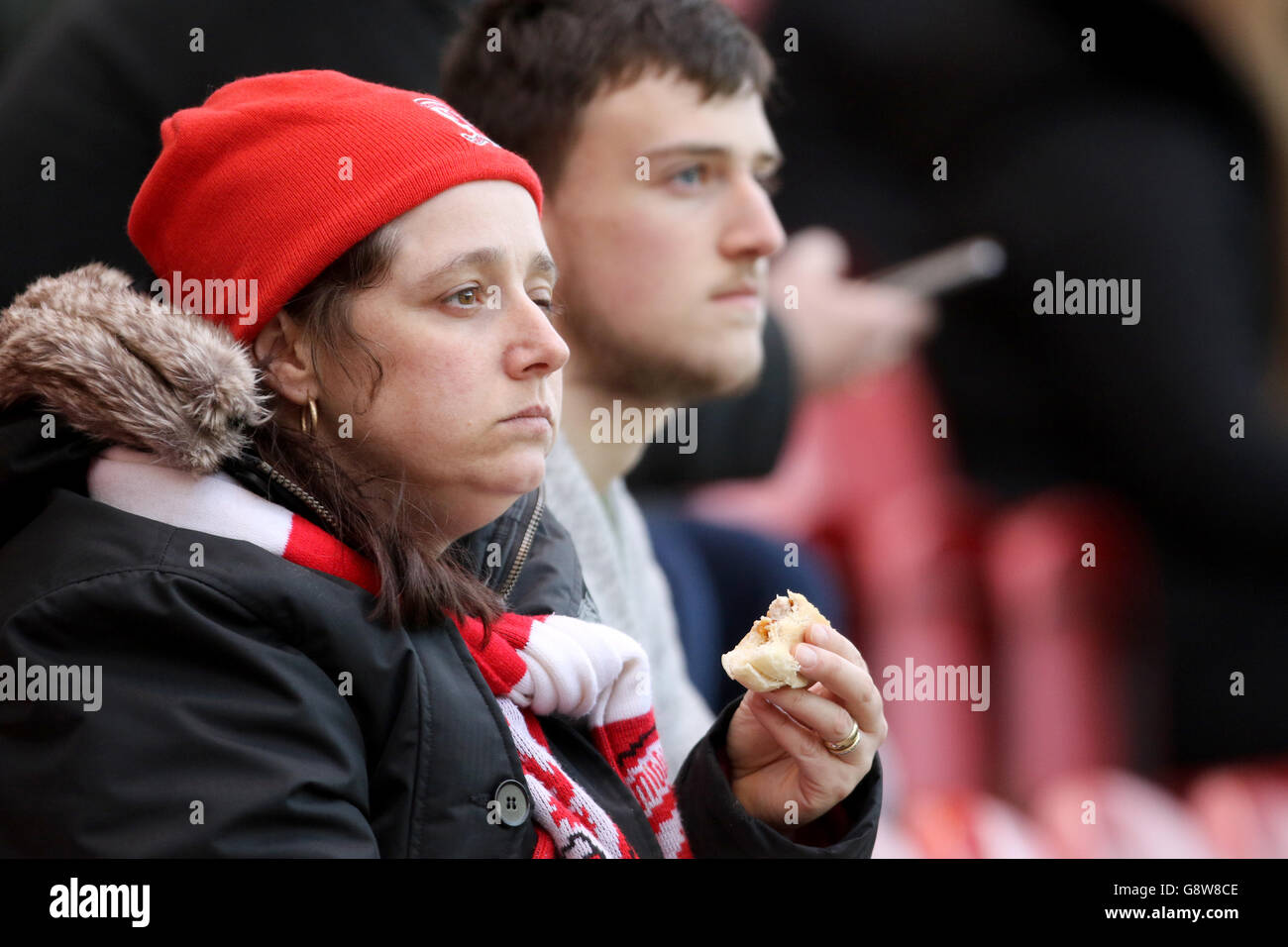 Football fans eating in stadium hi-res stock photography and images - Alamy