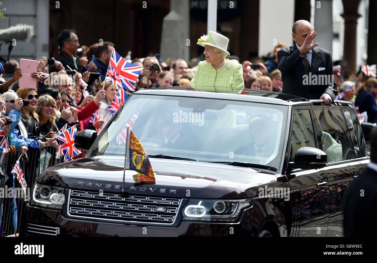 Queen Elizabeth II and the Duke of Edinburgh wave to well wishers from ...