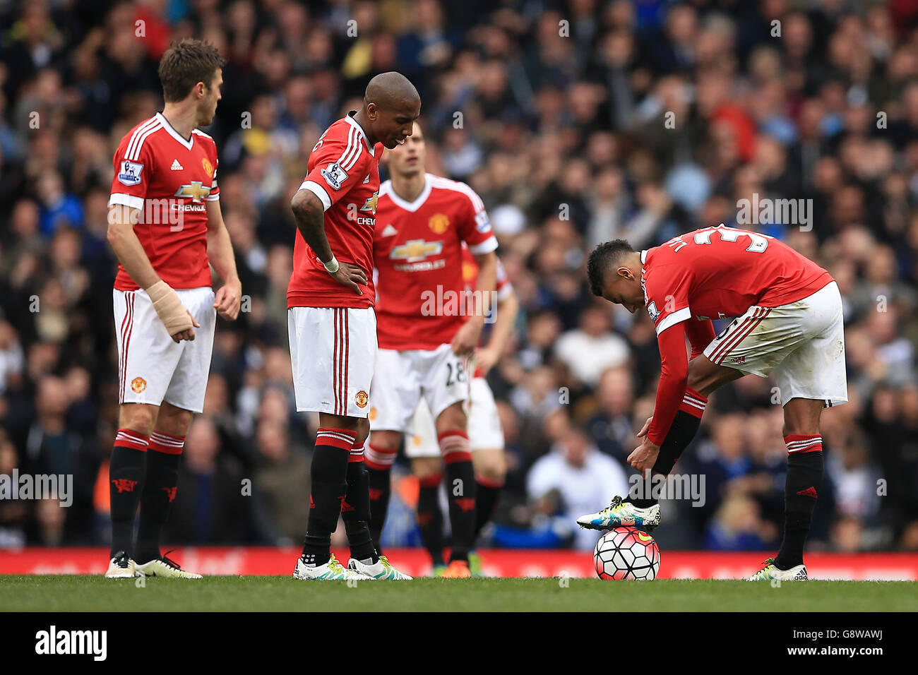 Manchester United players look dejected as they prepare to restart the ...