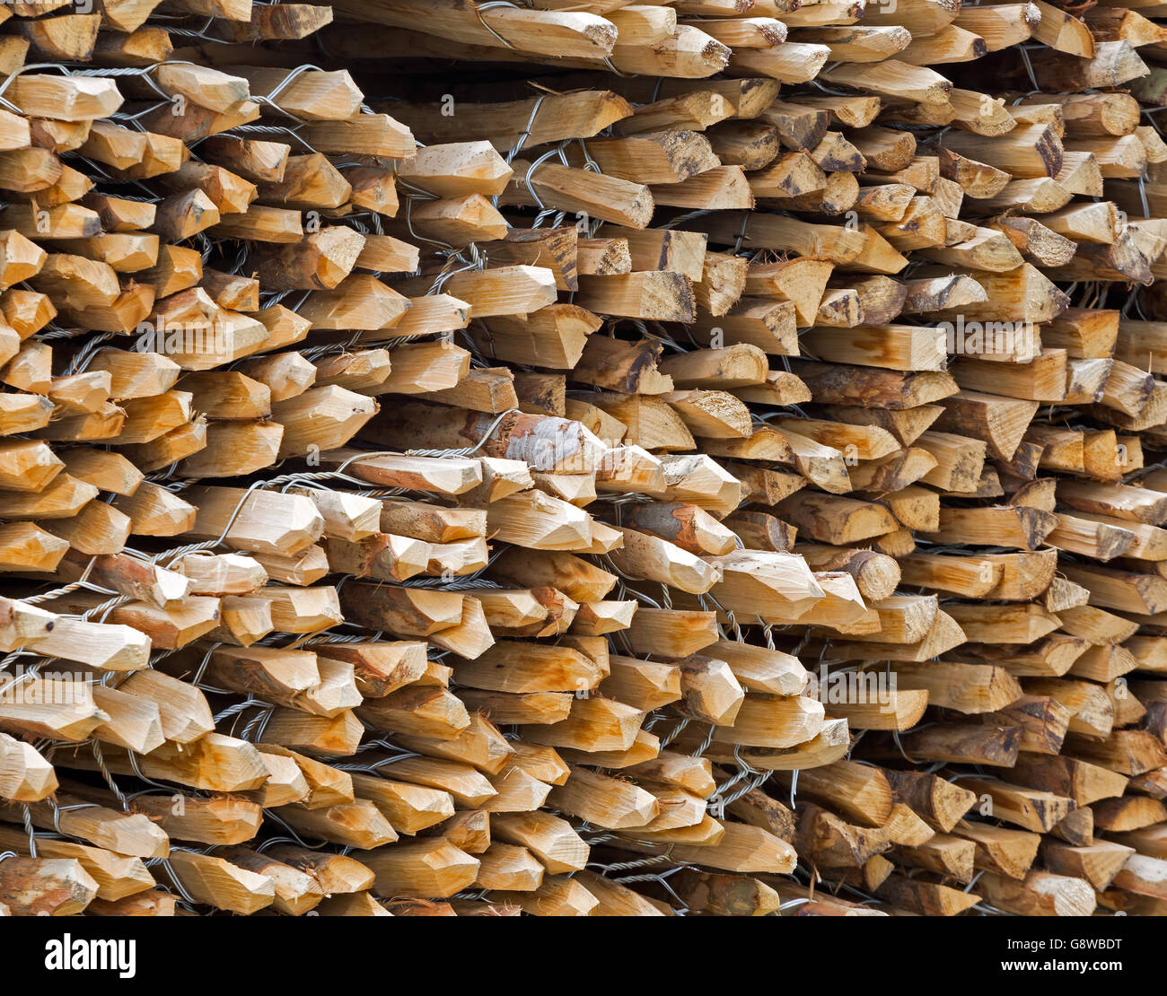 Piles of split chestnut paling Stock Photo - Alamy