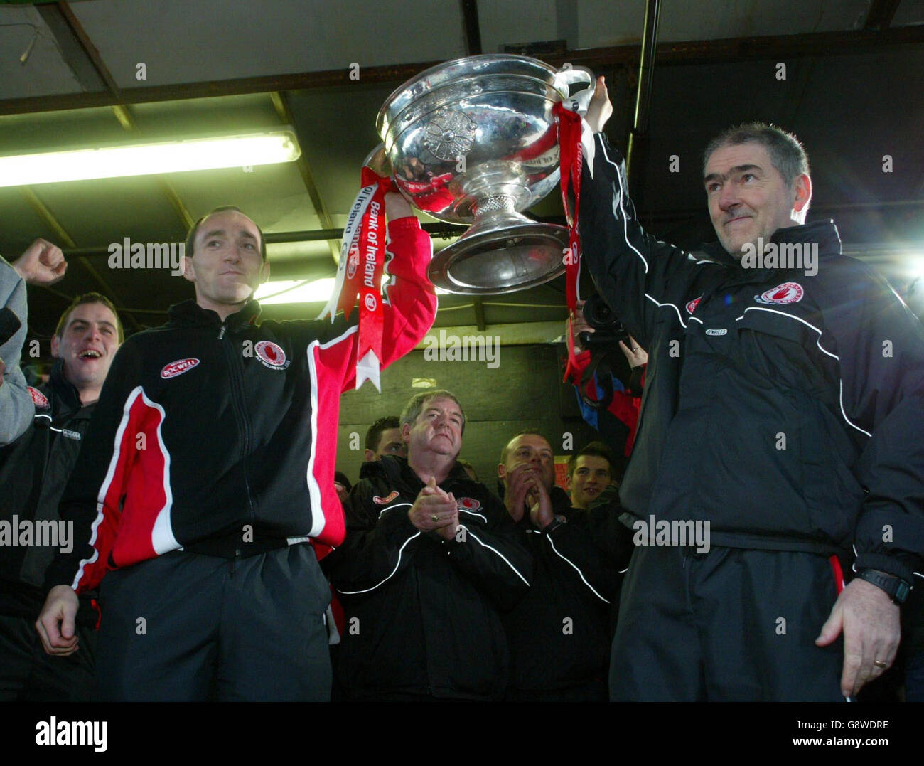 Tyrone captain Brian Dooher (left and manager Mickey Harte shows the ...