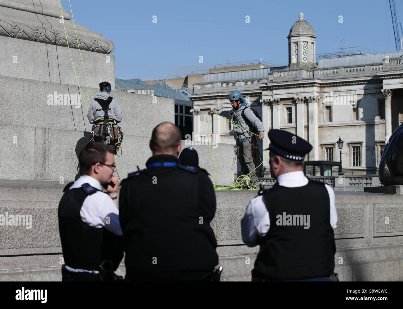 s Trafalgar Square to place a mask on the statue of Lord Nelson as part ...