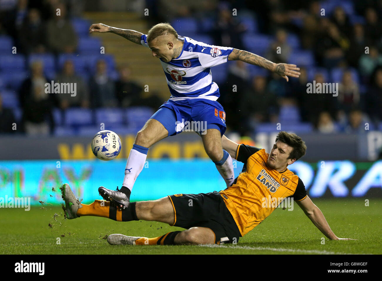 Reading's Deniss Rakels (left) and Hull City's Harry Maguire battle for ...