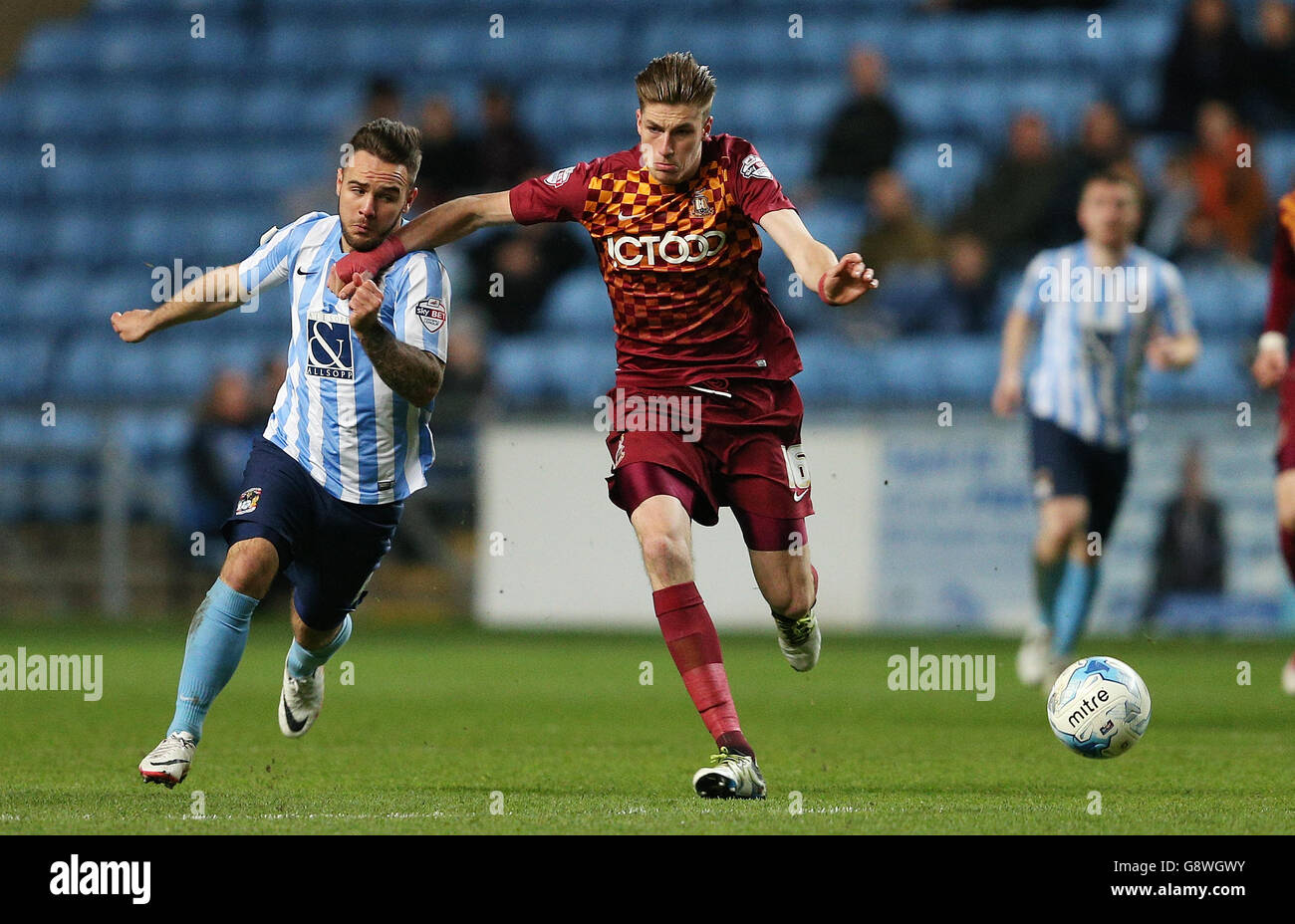 Coventry City's Adam Armstrong (left) and Bradford City's Reece Burke ...