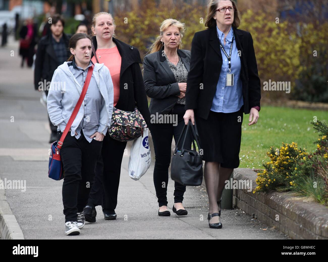 Julie Finch (second right), the mother of James Attfield, arrives at ...