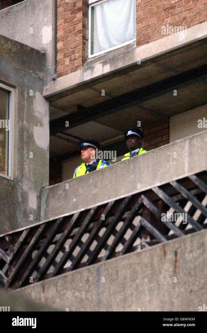 Police officers stand in the milford towers complex in catford hi-res ...