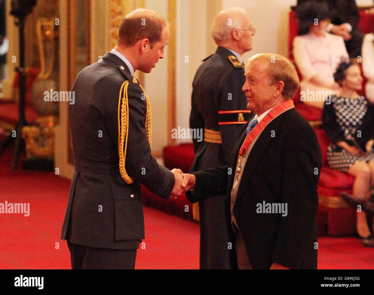 Former England football player Francis Lee receiving a CBE from the ...