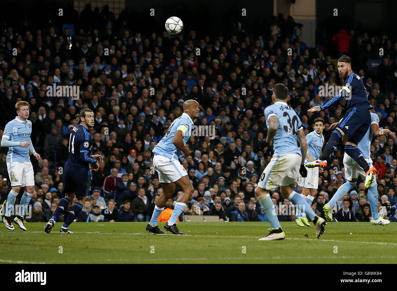 Real Madrid's Sergio Ramos (right) directs a header towards goal during ...