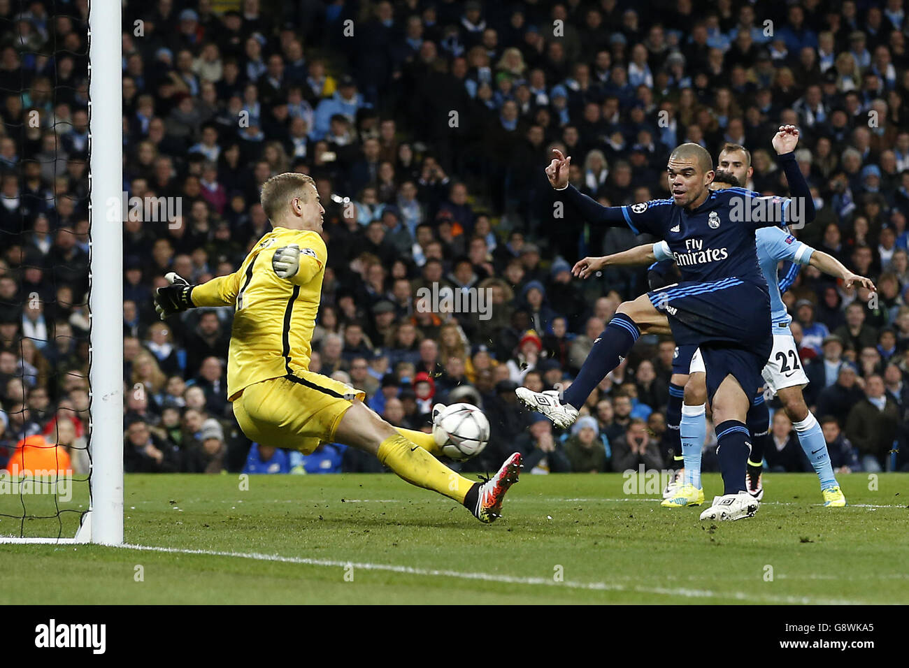 Manchester City goalkeeper Joe Hart (left) saves an effort on goal from ...