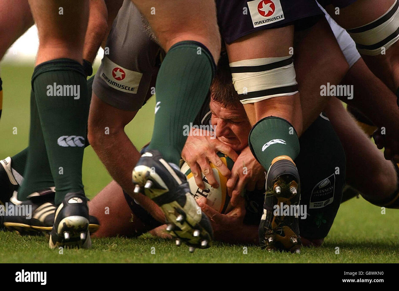 London Irish's David Paice wraps up a loose ball against Wasps' during ...