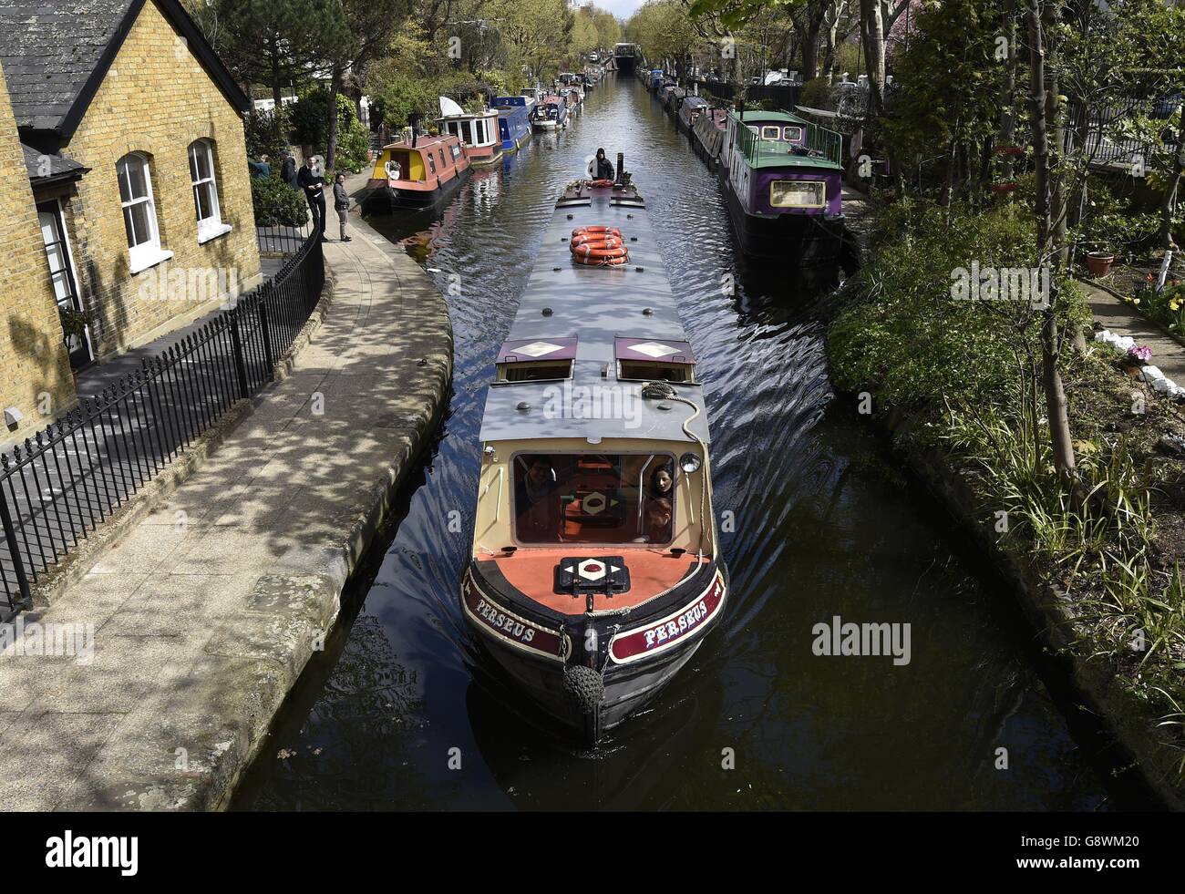 Waterbus Perseus carries passengers through Little Venice in London as ...