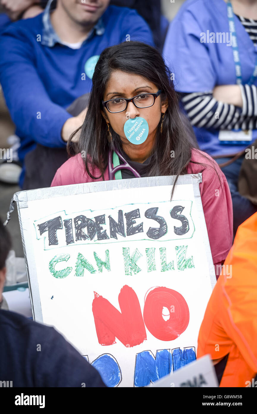 Junior doctors and supporters of the BMA strikes wear stickers over ...