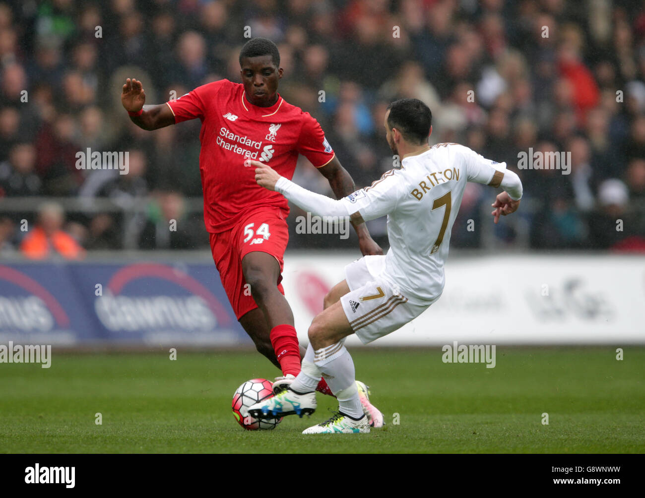 Liverpool's Sheyi Ojo (left) and Swansea City's Leon Britton battle for ...