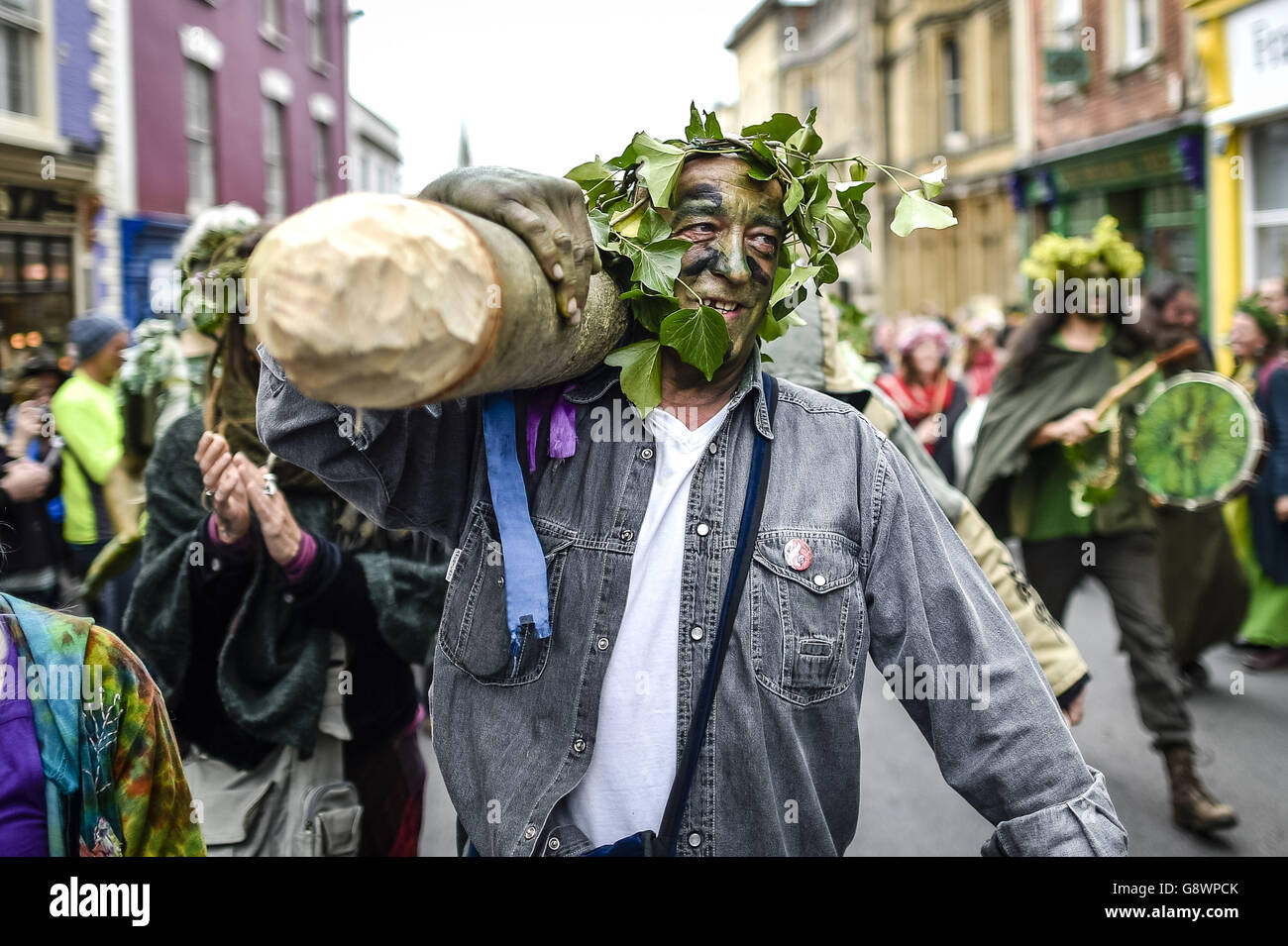 A man carries a freshly cut maypole during the Glastonbury Beltane ...