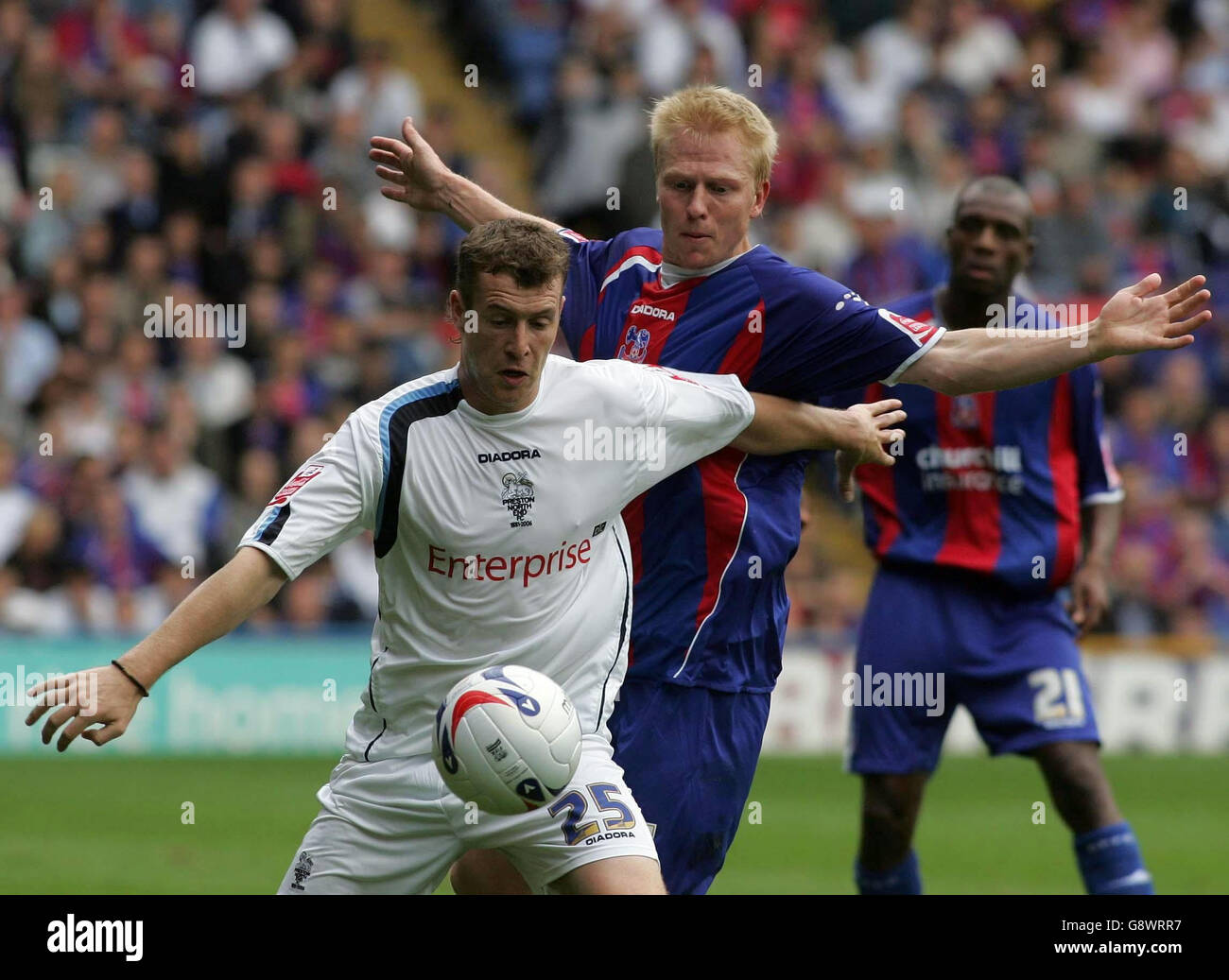 Preston's Adam Nowland (L) in action with Crystal Palace's Aki ...