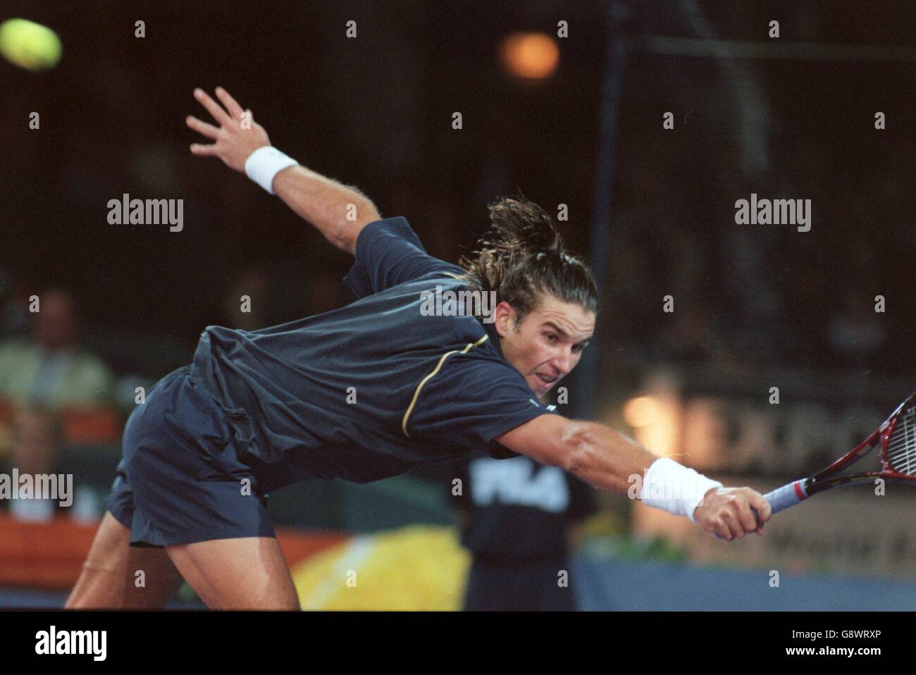 Patrick rafter works hard to return a serve hi-res stock photography ...