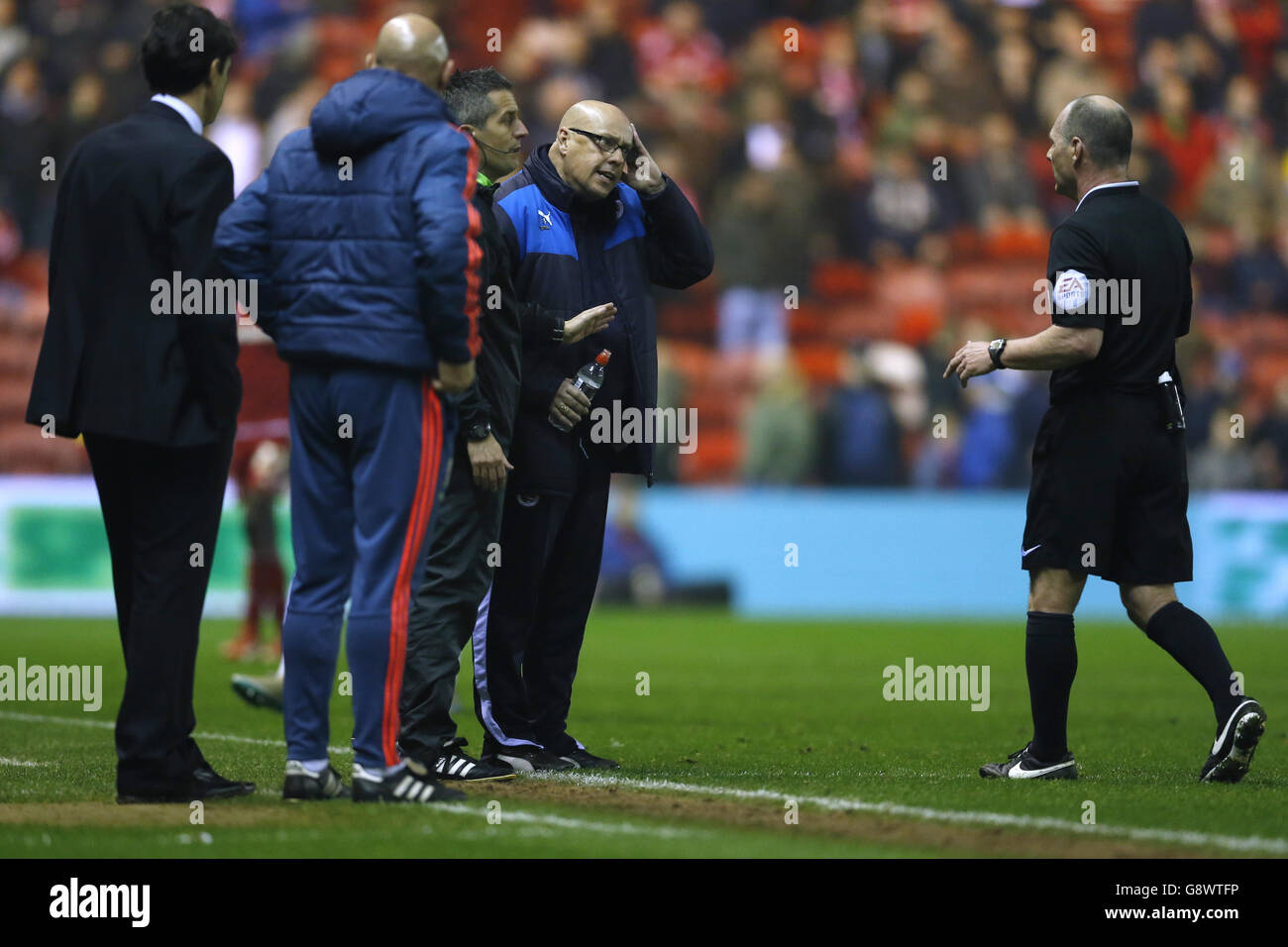 Reading manager Brian McDermott speaks with referee Scott Duncan (right ...