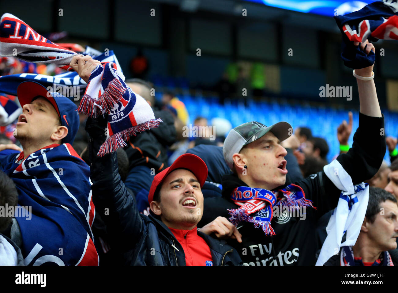 Paris Saint-Germain fans cheer on their side in the stands during the ...